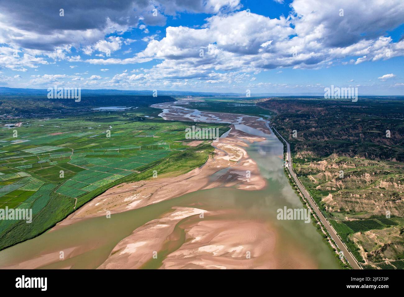 YUNCHENG, CHINA - JUNE 28, 2022 - Sun rays shine through clouds on the ...