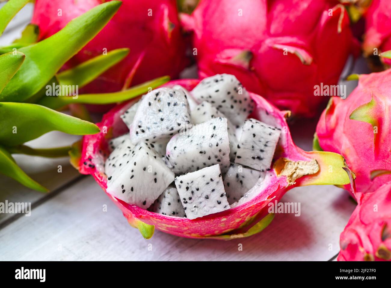 dragon fruit slice on fruit peel with pitahaya background , fresh white ...