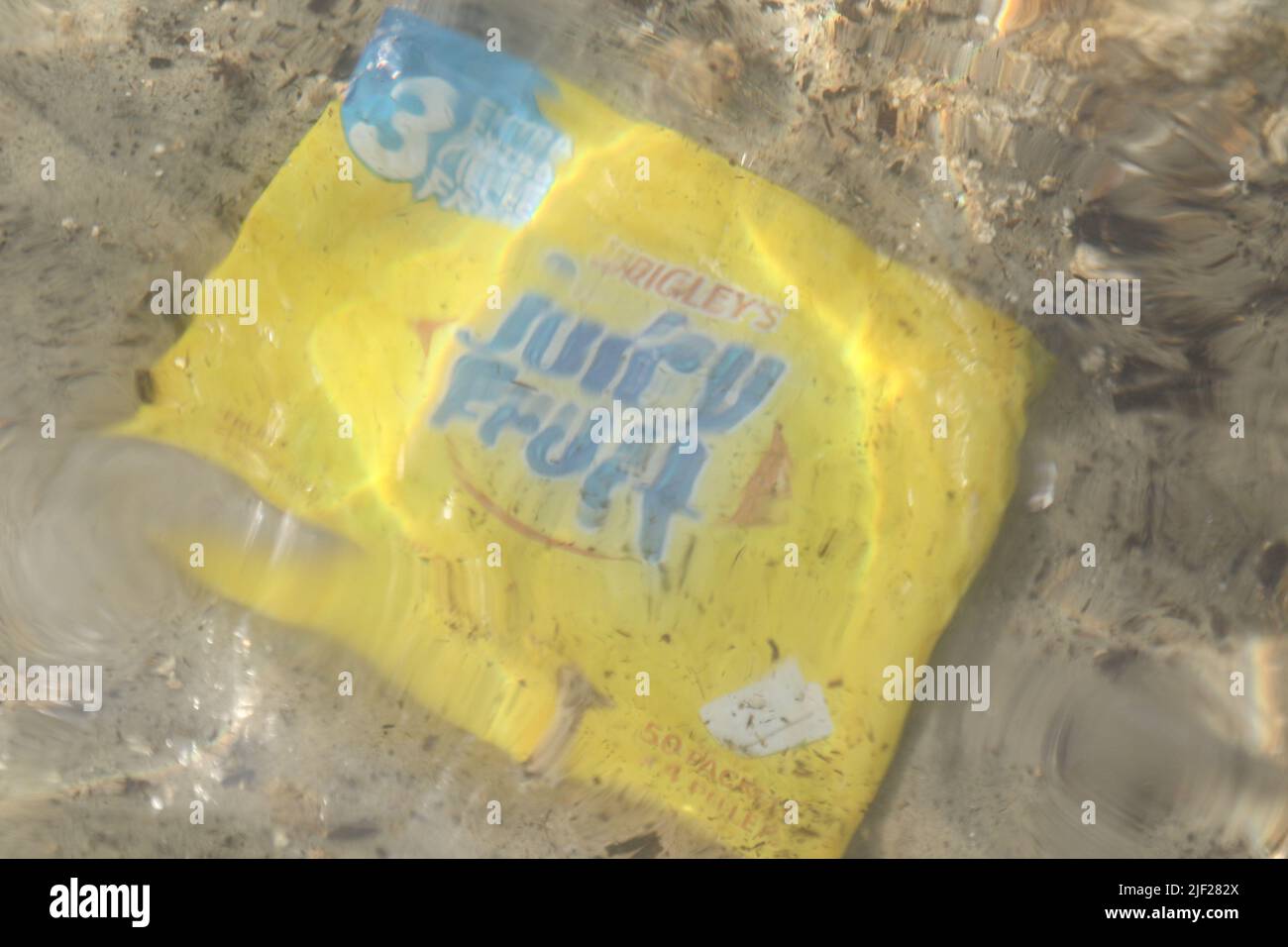 Mombasa, Kenya. 26th June, 2022. A Wringley's PK plastic gum wrapper is ...