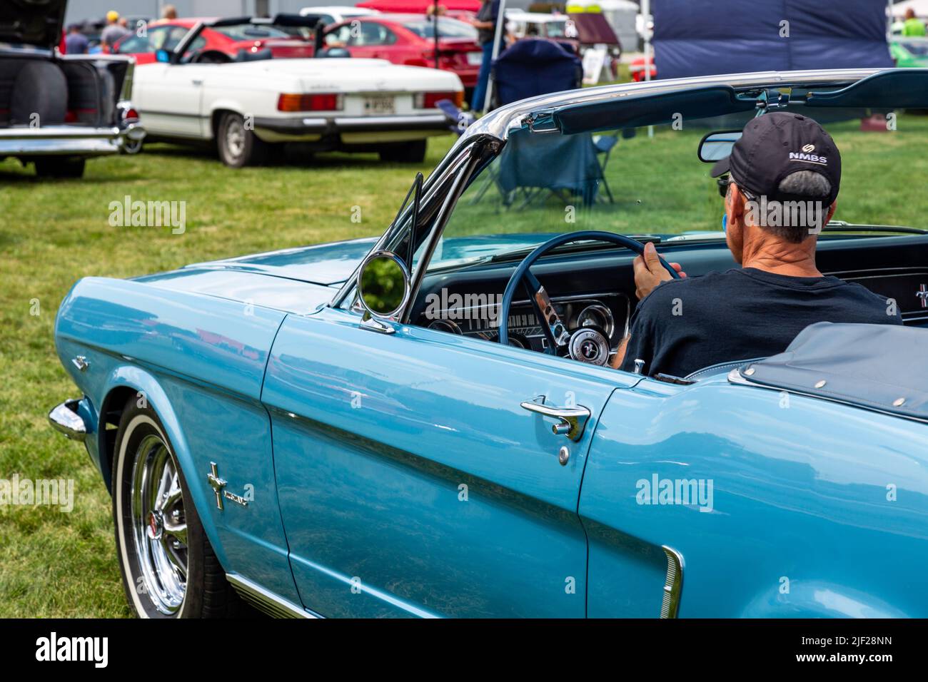 A stylish blue 1965 Ford Mustang convertible at a car show in Fort ...
