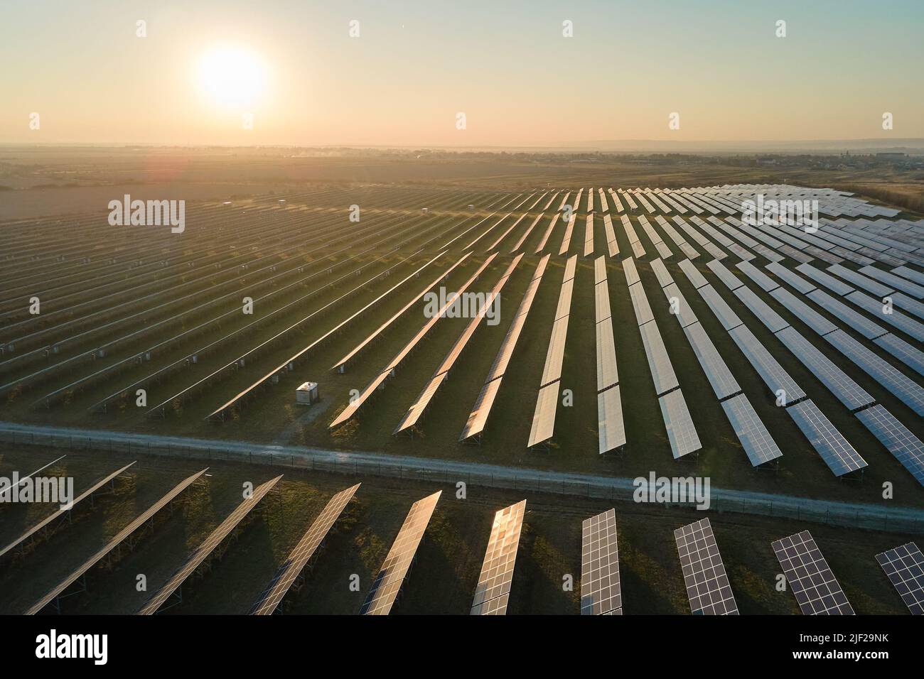 Aerial view of big sustainable electric power plant with many rows of ...
