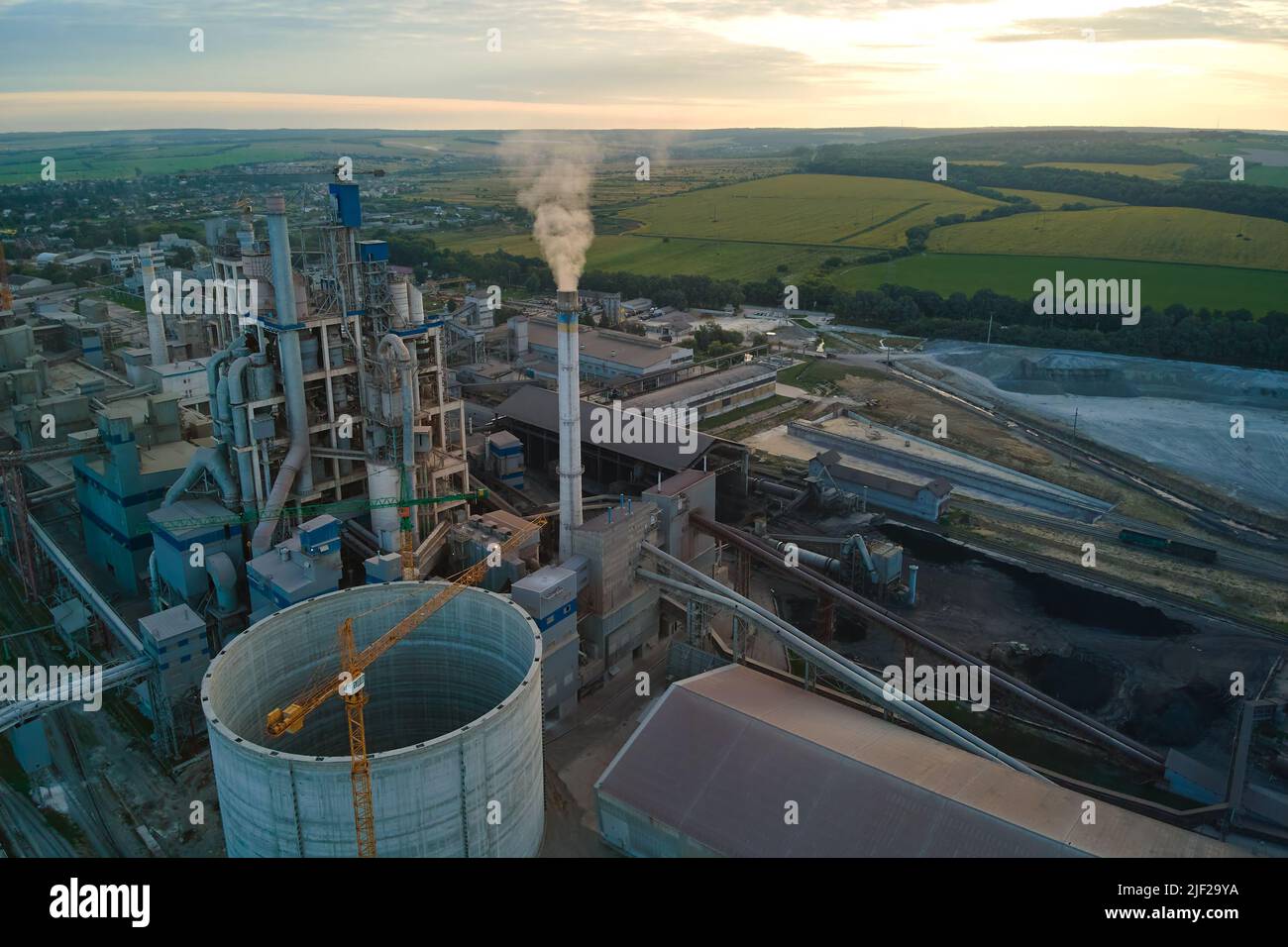 Aerial view of cement factory with high concrete plant structure and ...