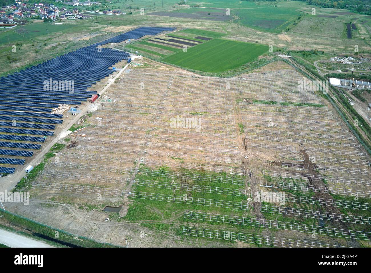 Aerial view of electrical power plant under construction with truck ...