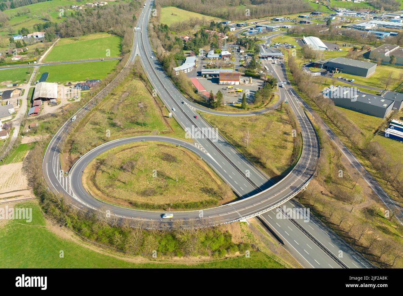 Aerial view of highway road intersection with fast moving heavy traffic ...