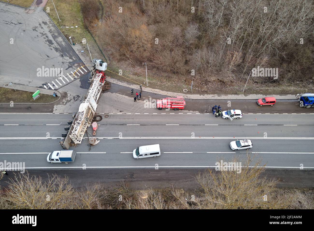 Aerial view of road accident with overturned truck blocking traffic ...