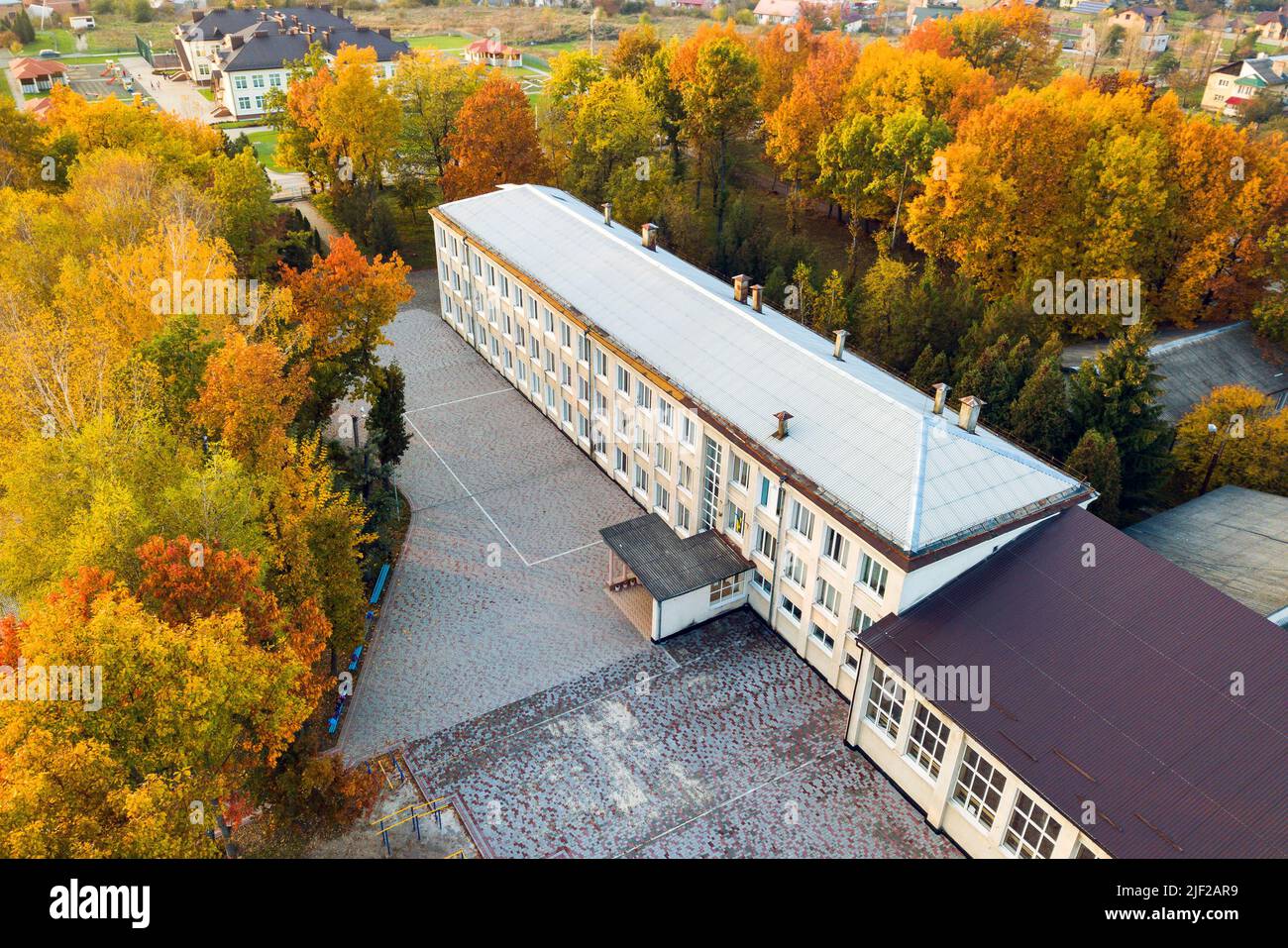 Aerial view of school, college or kindergarten building with big yard ...