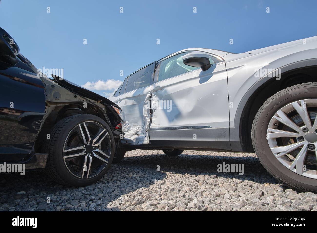 Damaged in heavy car accident vehicles after collision on city street ...