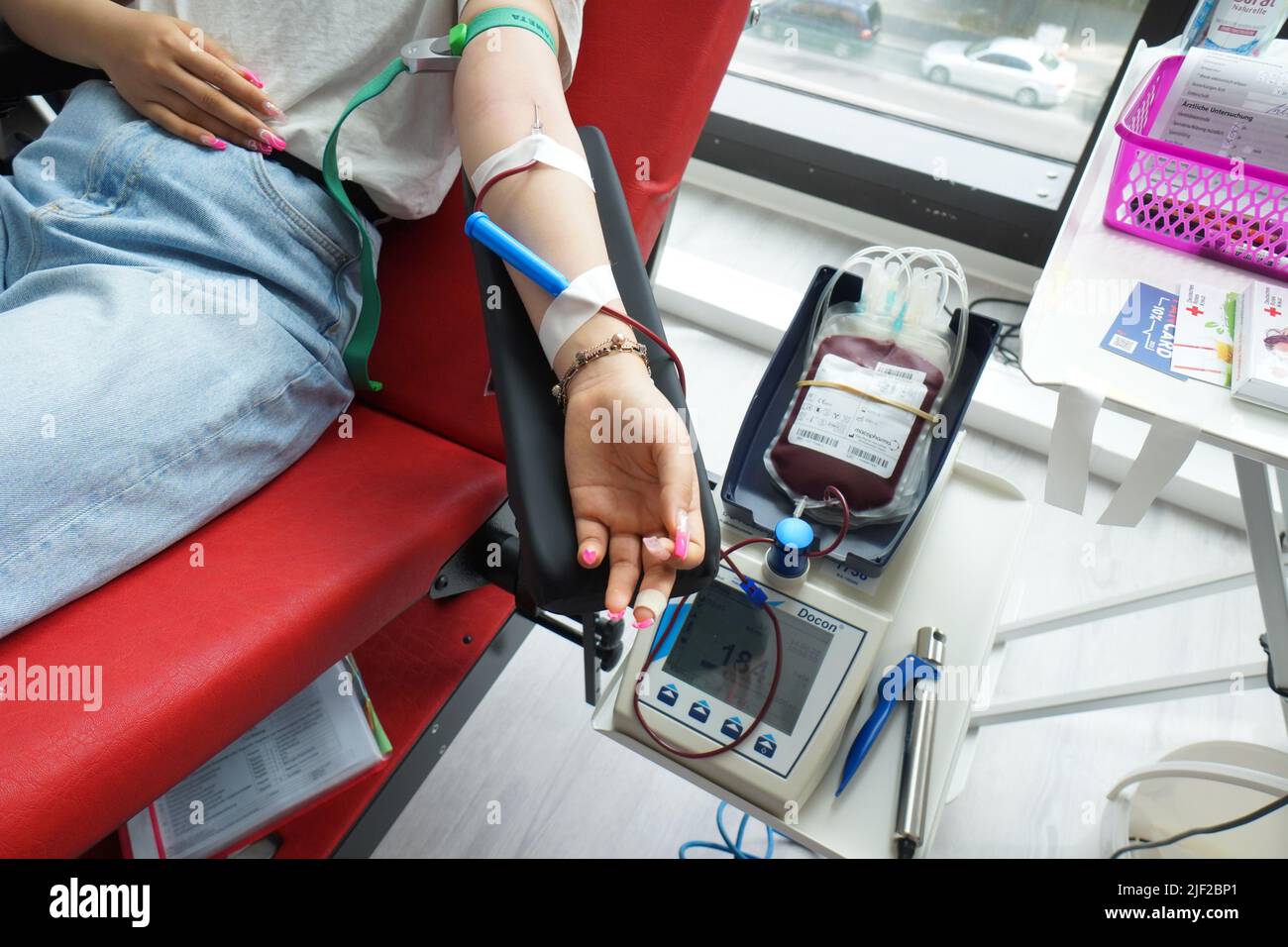 Berlin, Germany. 14th June, 2022. Blood is drawn at a DRK blood ...
