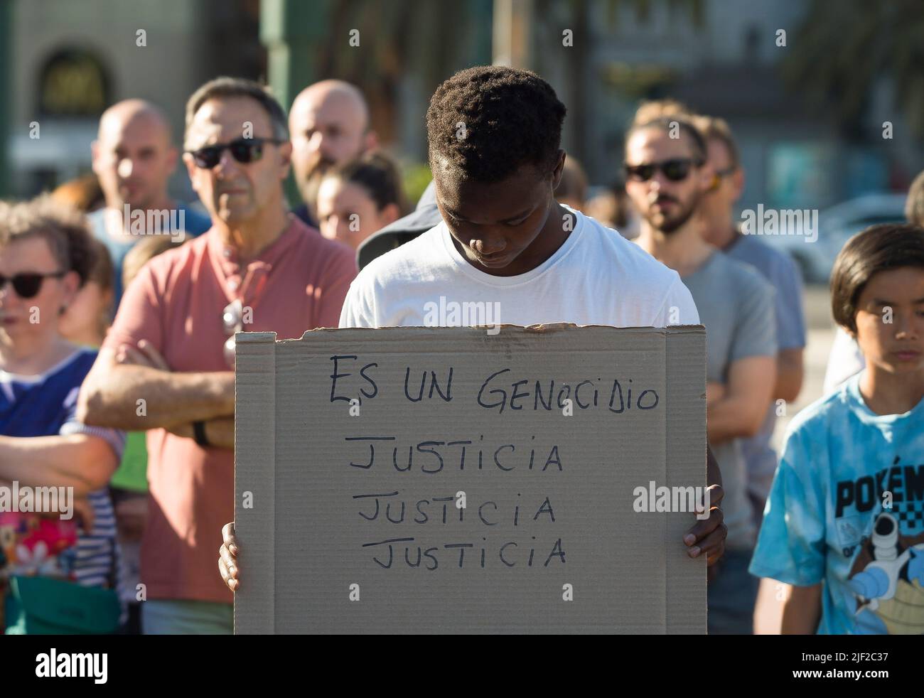 Malaga, Spain. 28th June, 2022. A protester holds a placard expressing ...