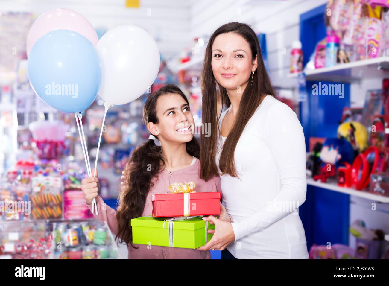 Happy people in toys store Stock Photo - Alamy