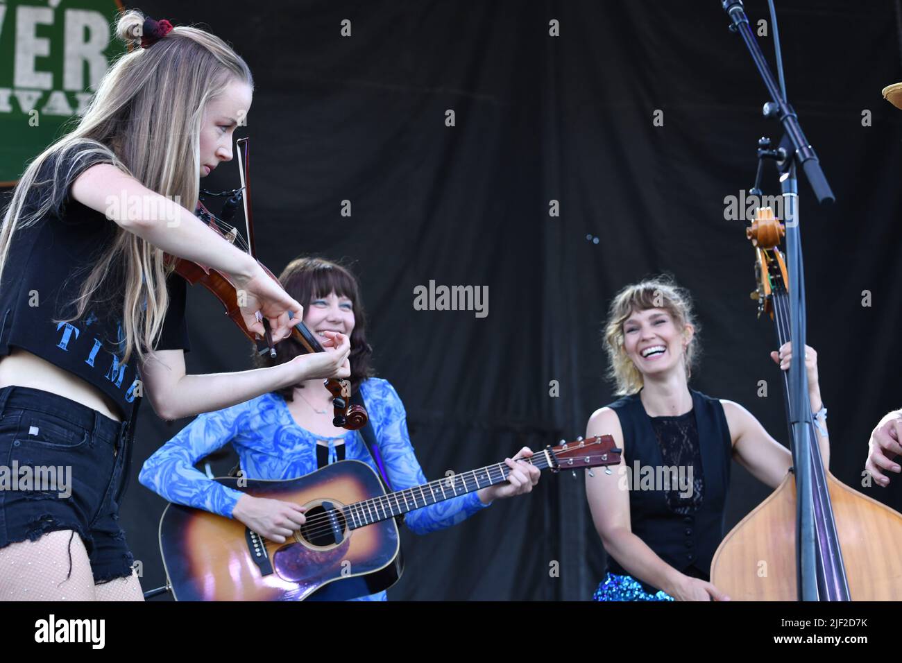 Molly Tuttle and Golden Highway are shown performing on stage during a ...