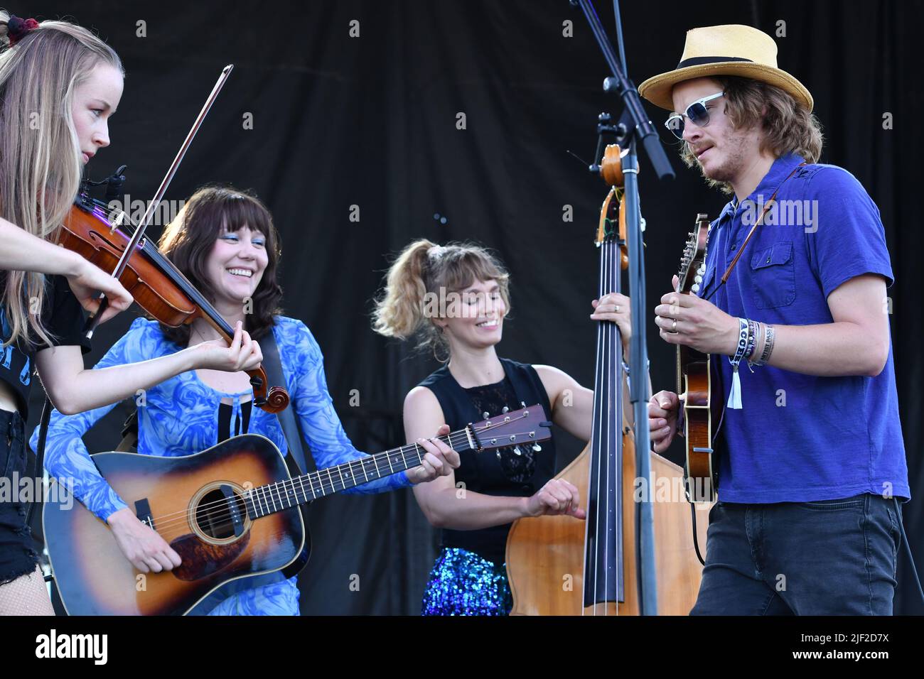 Molly Tuttle and Golden Highway are shown performing on stage during a ...