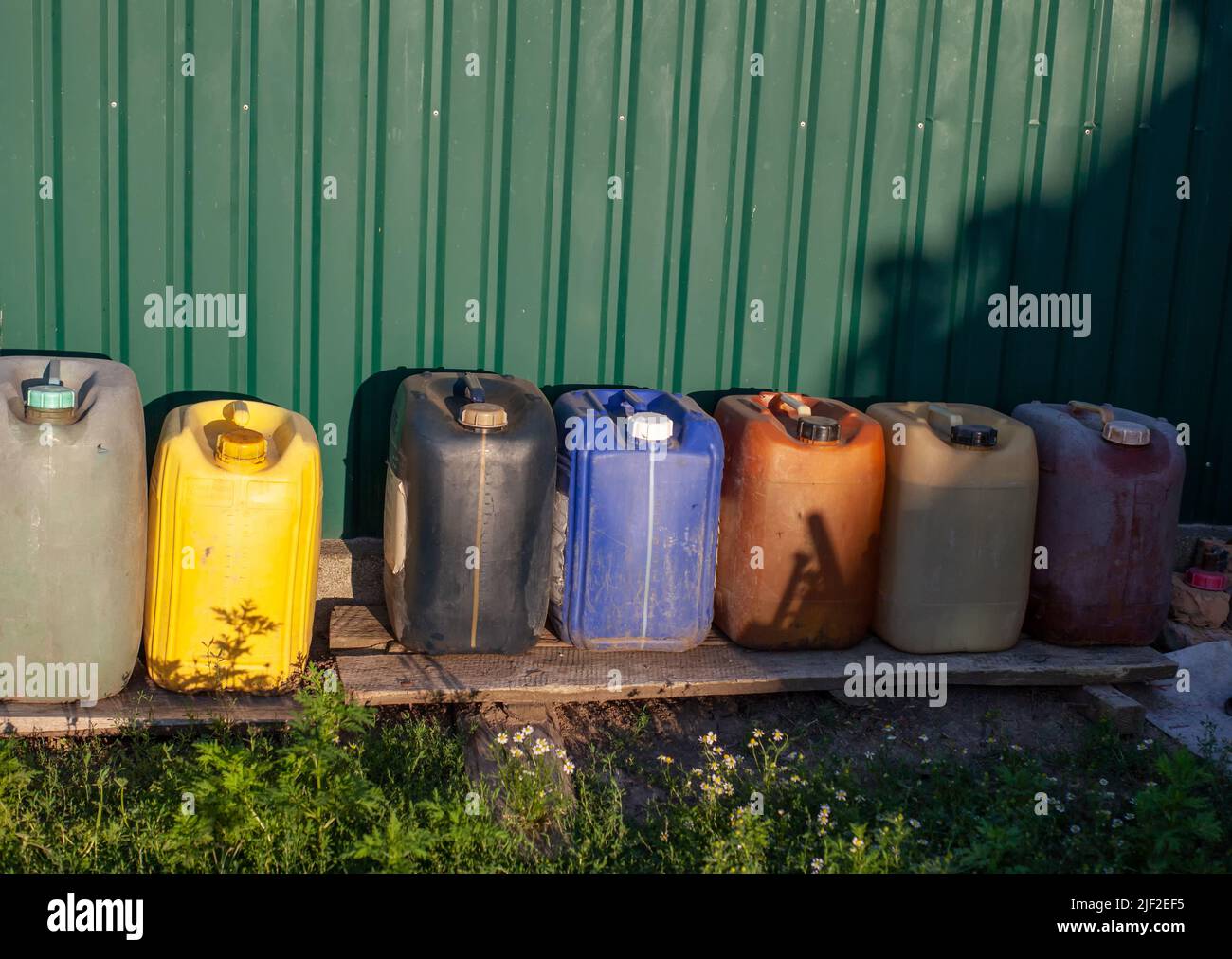 Old plastic fuel canisters. Stocks of diesel fuel on the farm. Fuel ...