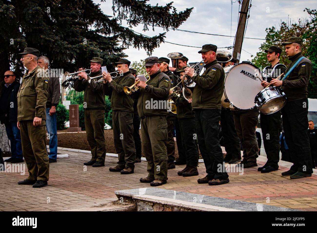 Military musicians playing music in honor of Sergey Titov. Family ...