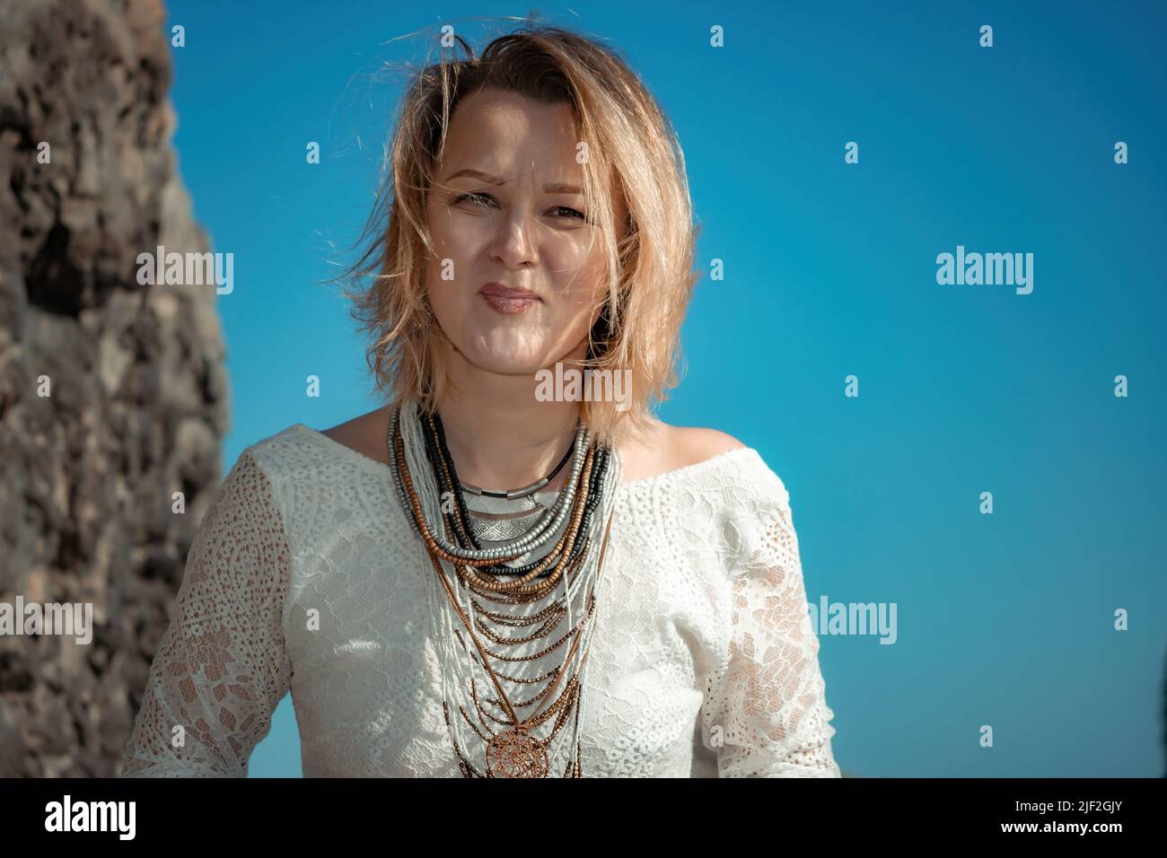 Woman in bohemian clothing on beach at sunset. Boho style for ...