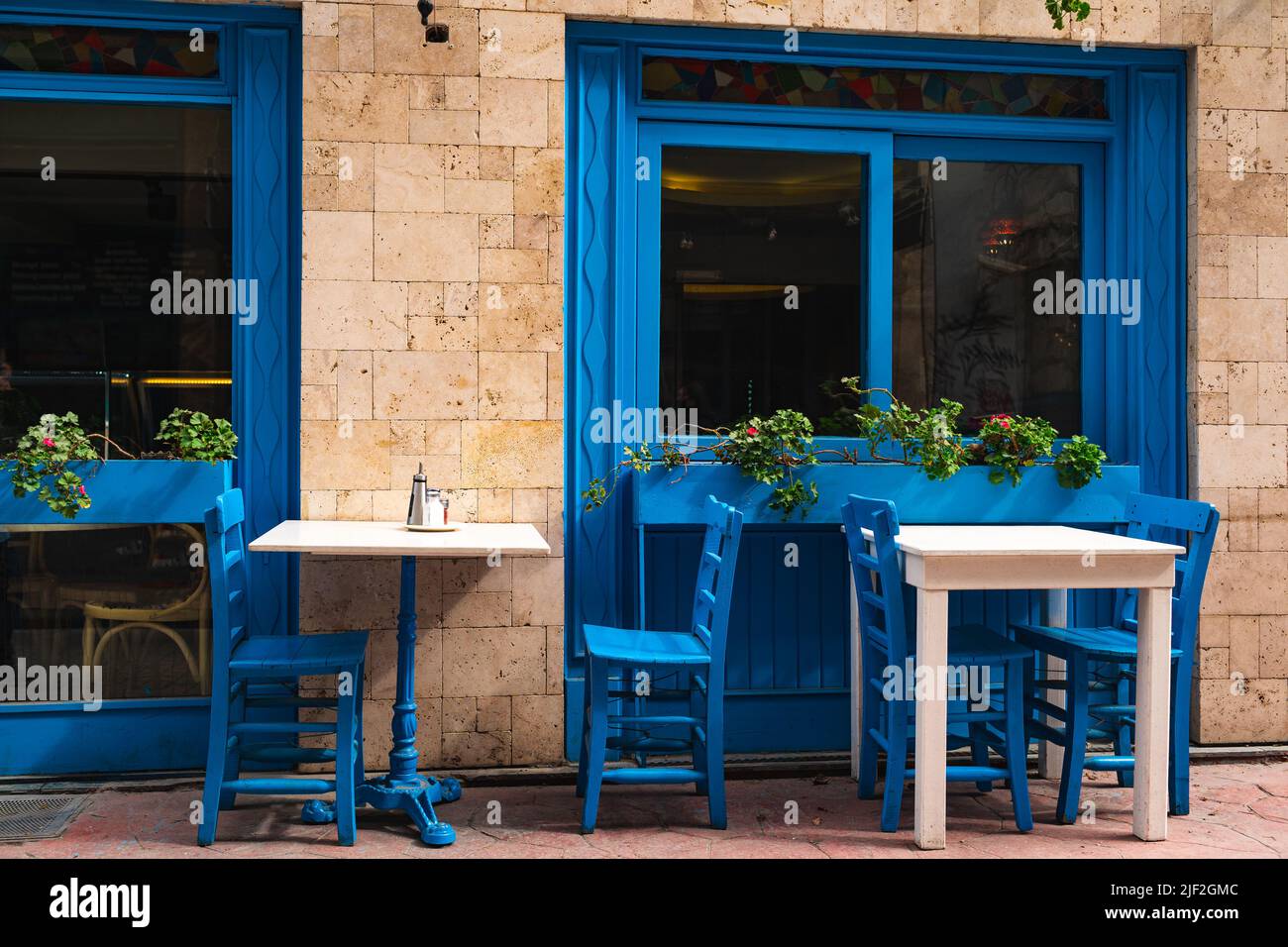 Street cafe in blue tones, empty tables in Istanbul Stock Photo - Alamy