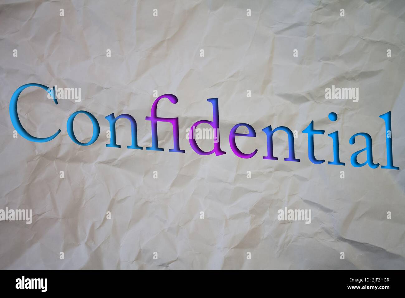 Confidential text with Torn, Crumpled White Paper on colored background ...