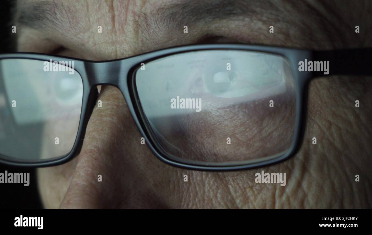 focused eyes of a businessman wearing computer glasses Stock Photo - Alamy