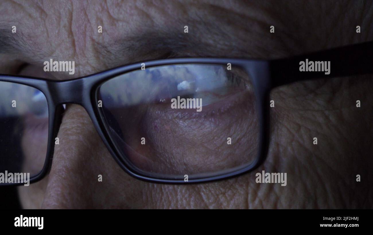 focused eyes of a businessman wearing computer glasses Stock Photo - Alamy