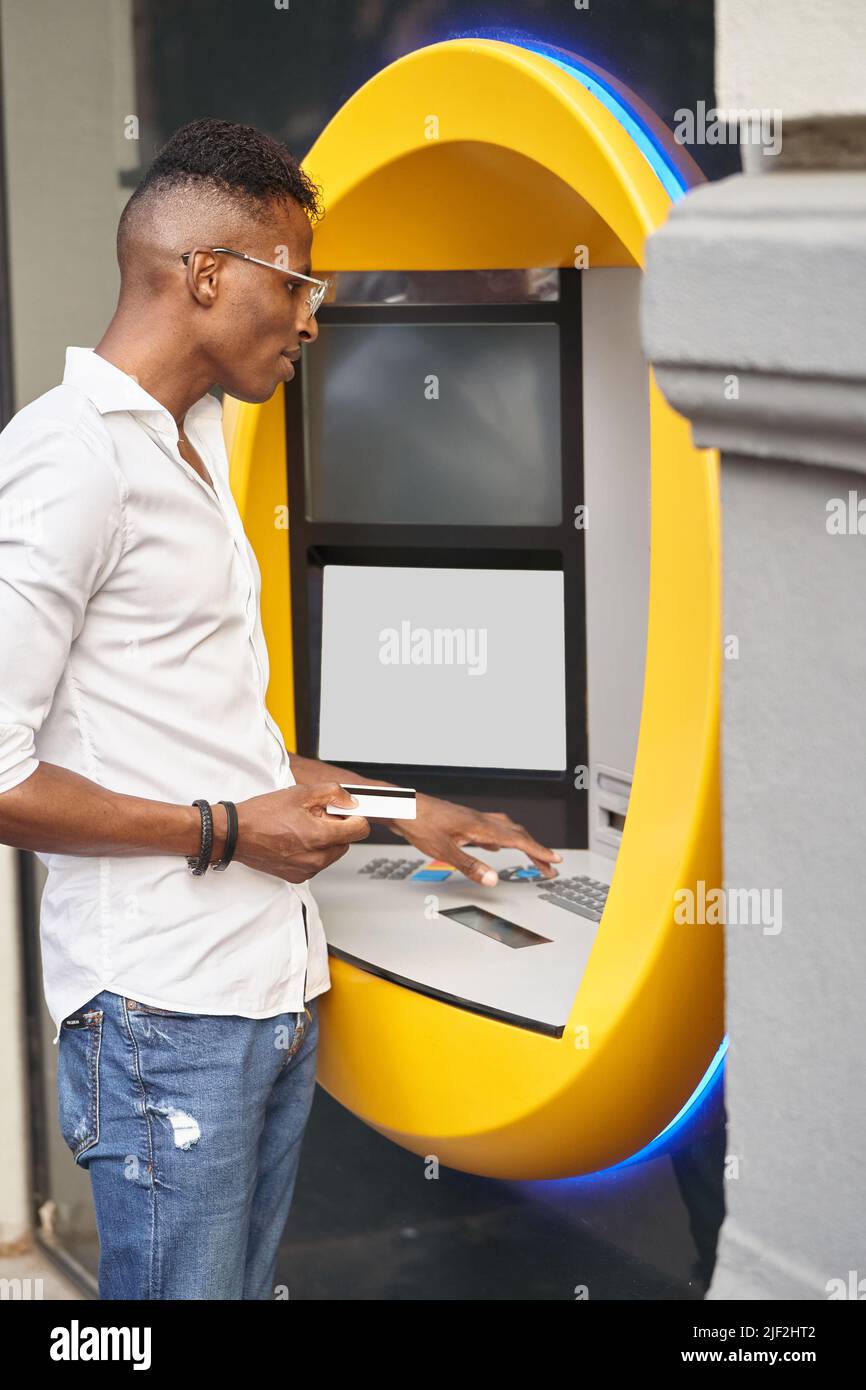 Man outside money checking hi-res stock photography and images - Alamy