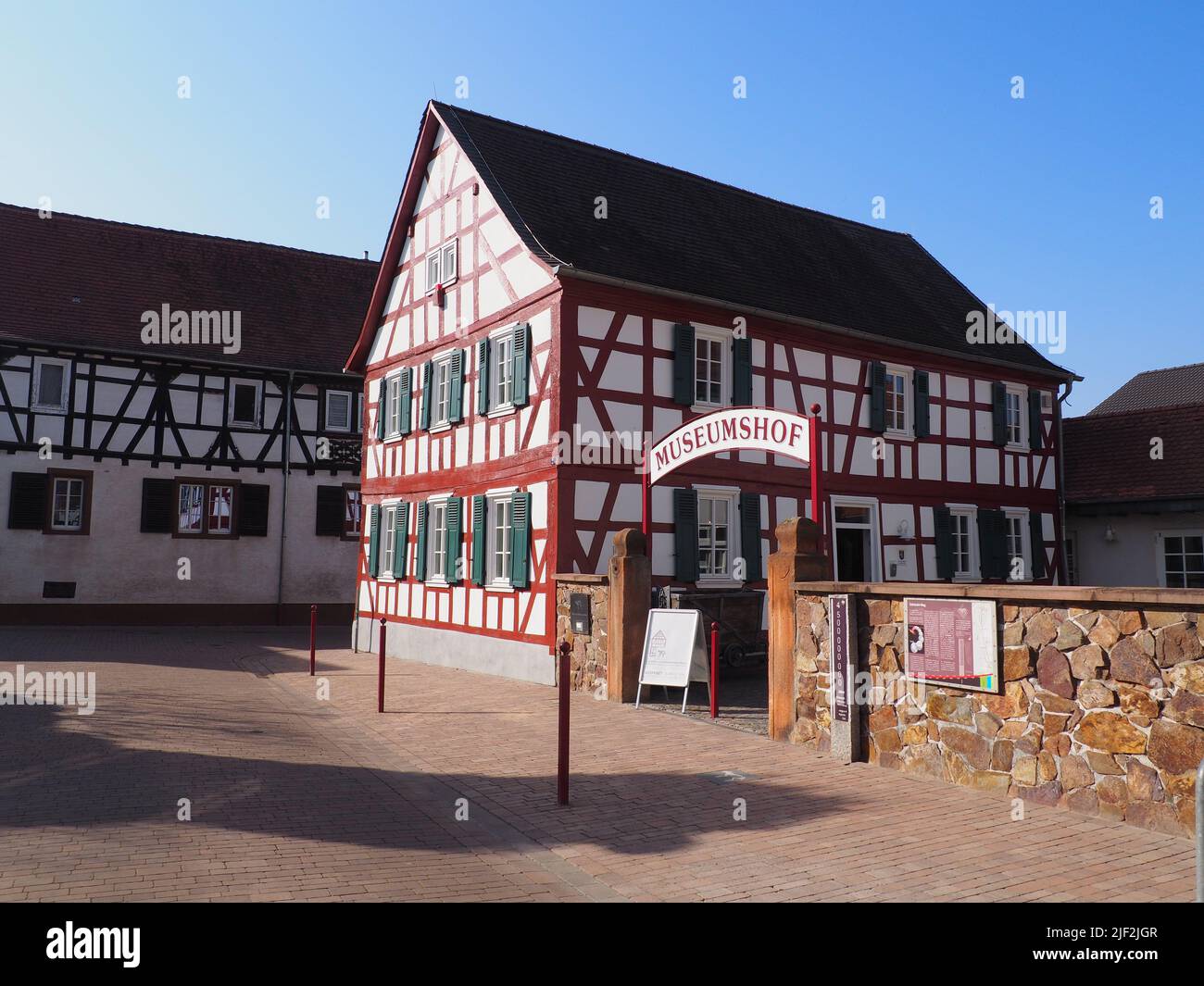 A shot of a half-timbered red and white house museum of fossils in ...