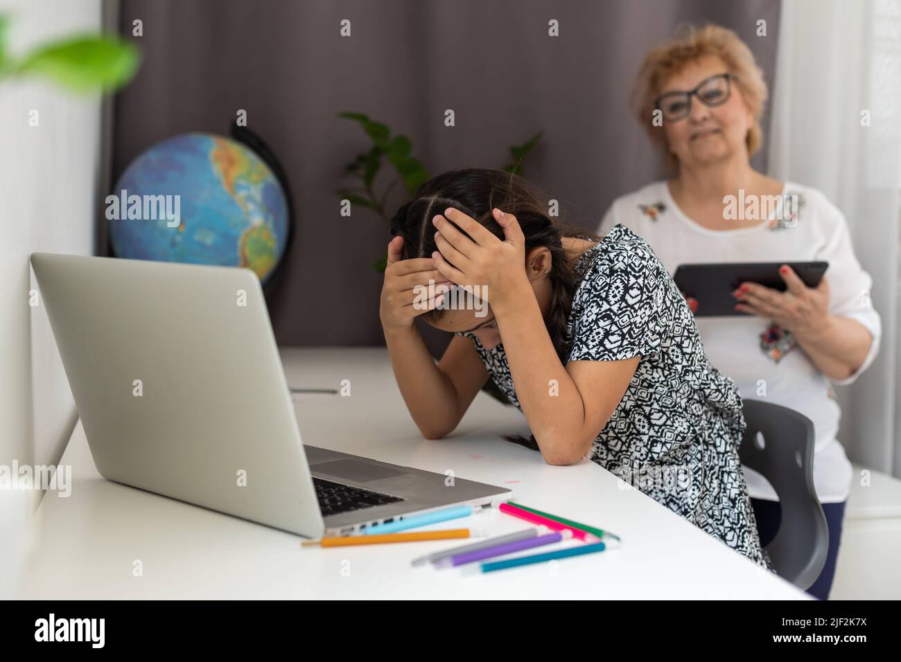little sad girl and grandmother argue at home Stock Photo - Alamy