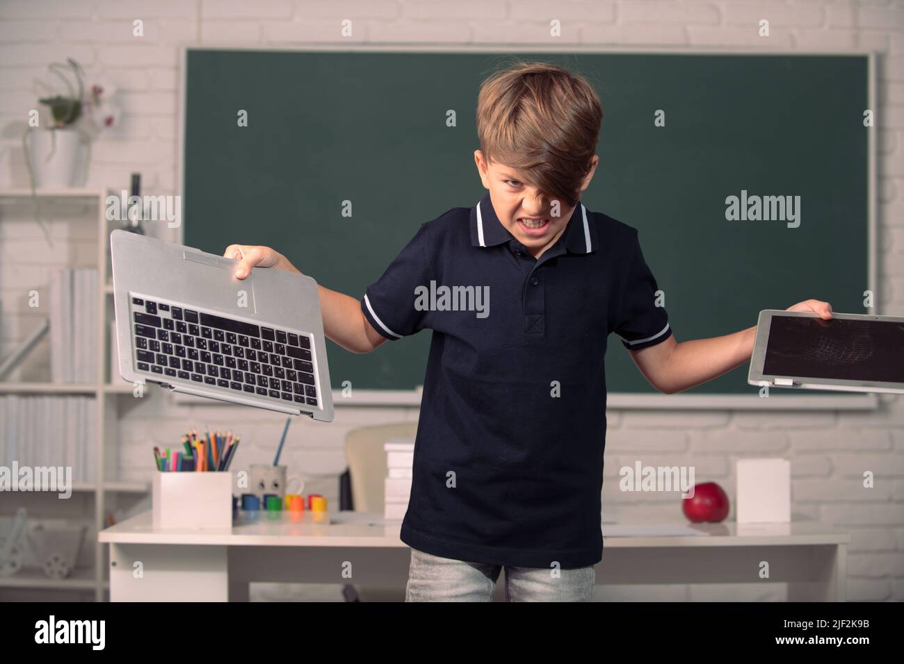 Bad boy student in opposition distance education. Angry kid broken ...