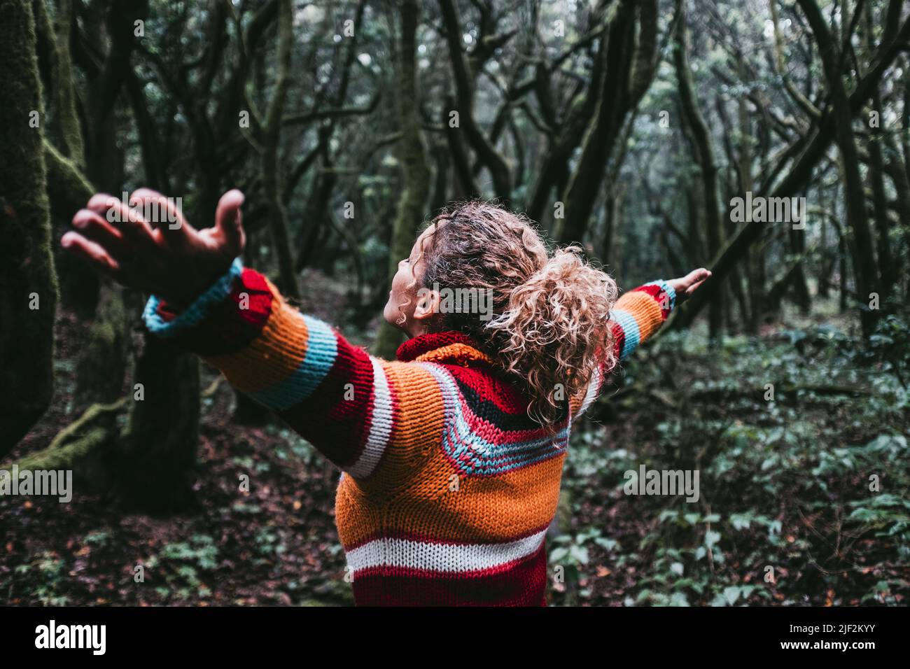 Freedom people enjoyng feeling with nature forest. Woman outstretching ...