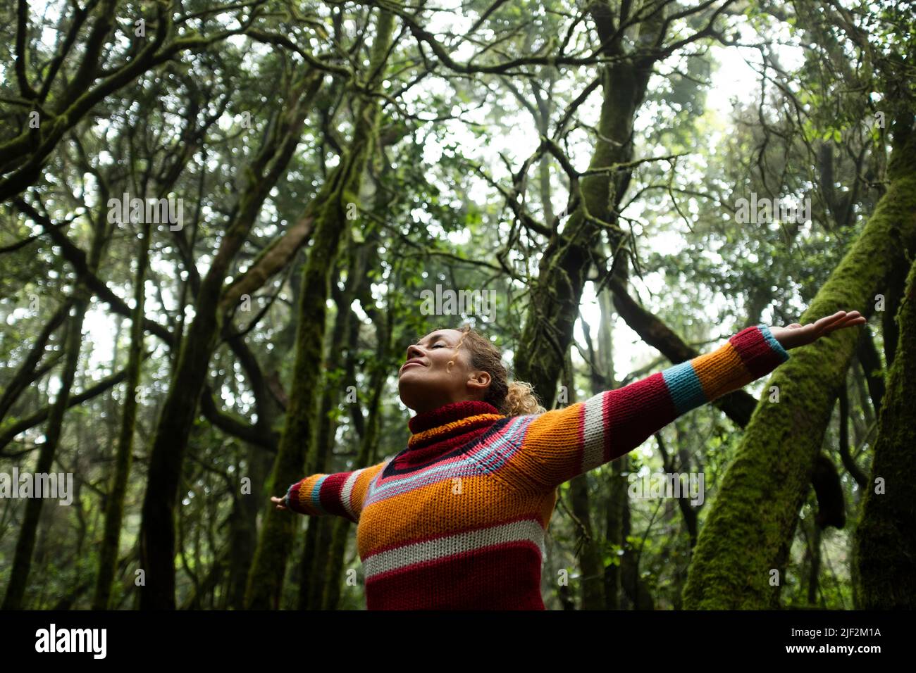 Freedom people enjoyng feeling with nature forest. Woman outstretching ...