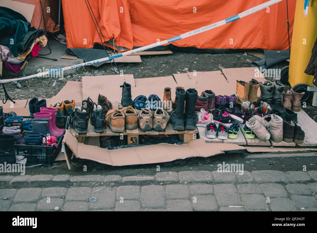 Donated shoes are placed on the floor for the Ukrainian refugees. The ...