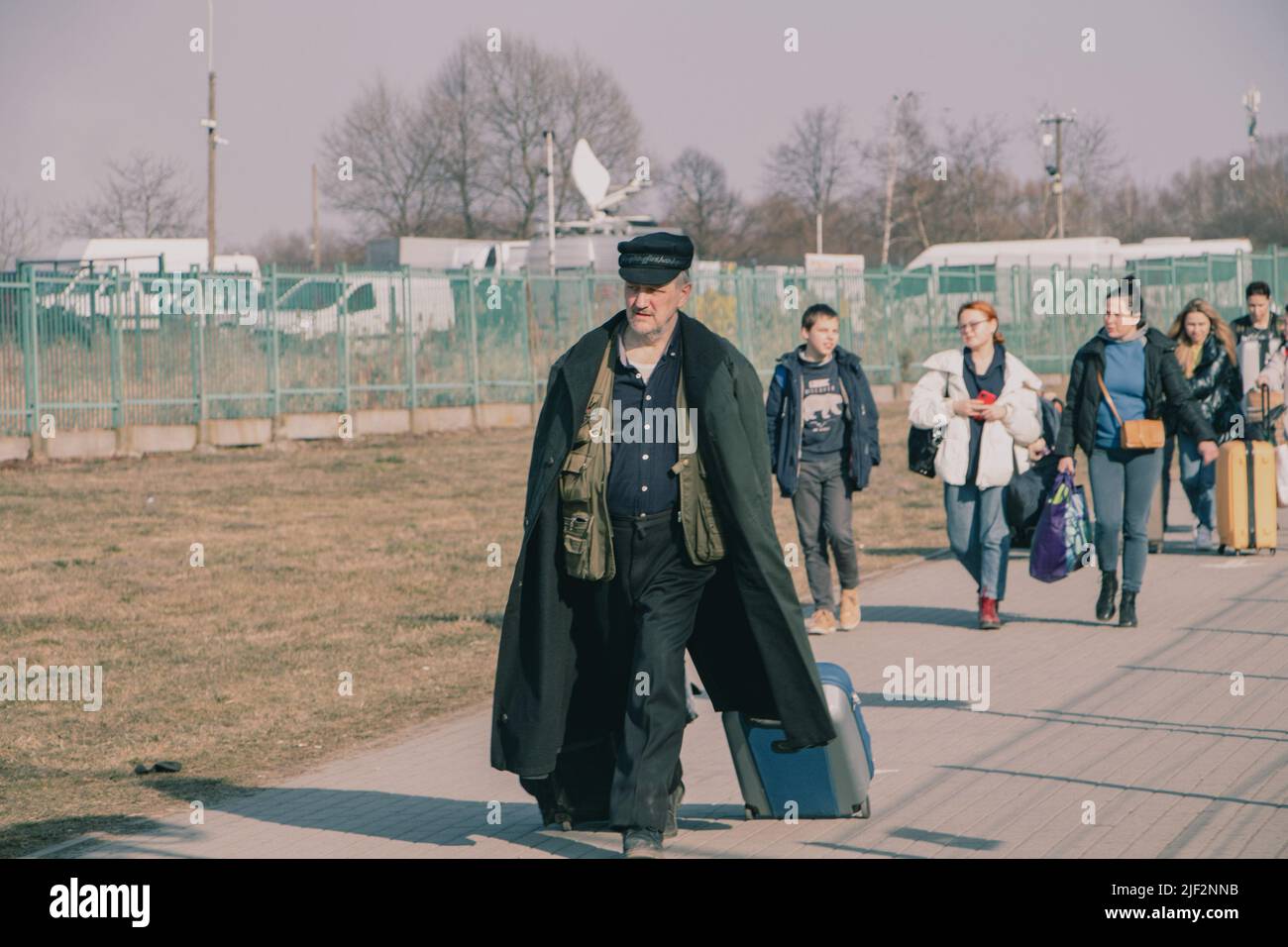 Medyka, Poland. 15th Mar, 2022. Refugees crossing the border by foot ...