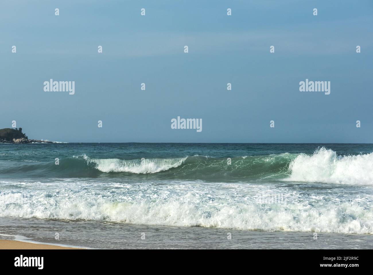 The big breaking waves during a strom at the beautiful summer sea shore ...