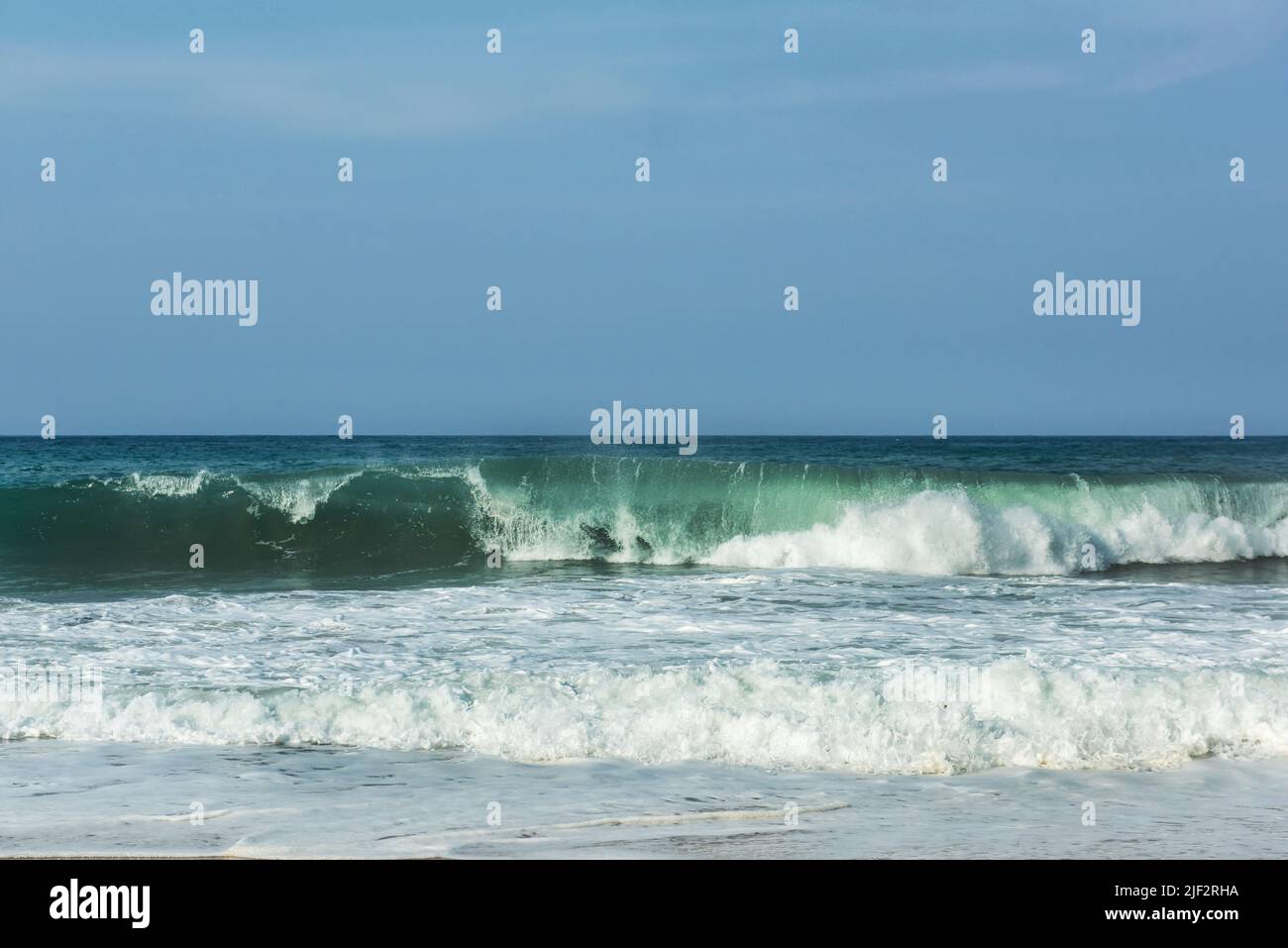 The big breaking waves during a strom at the beautiful summer sea shore ...