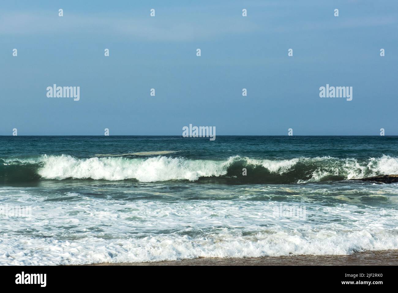 The big breaking waves during a strom at the beautiful summer sea shore ...