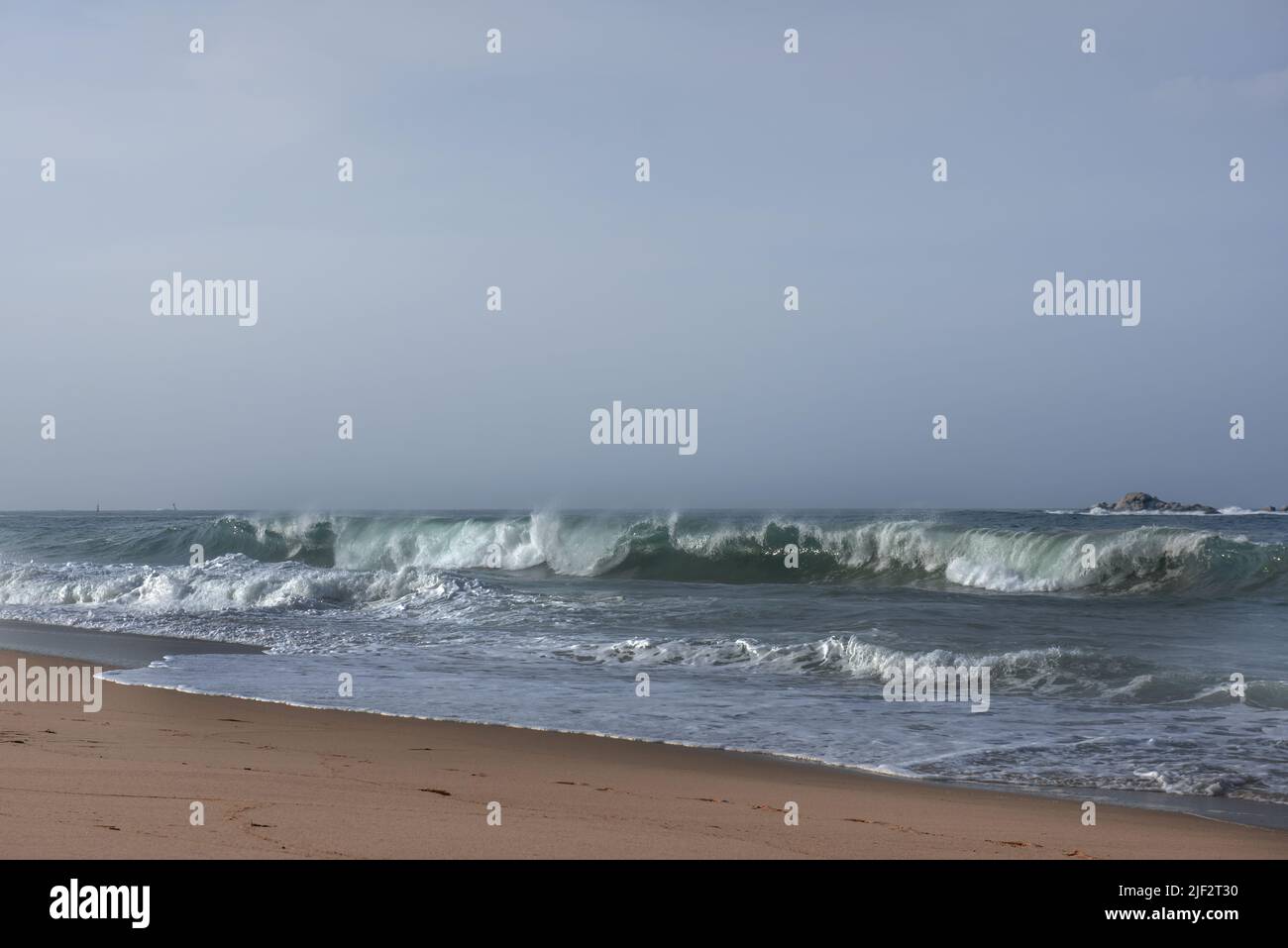 The big breaking waves during a strom at the beautiful summer sea shore ...