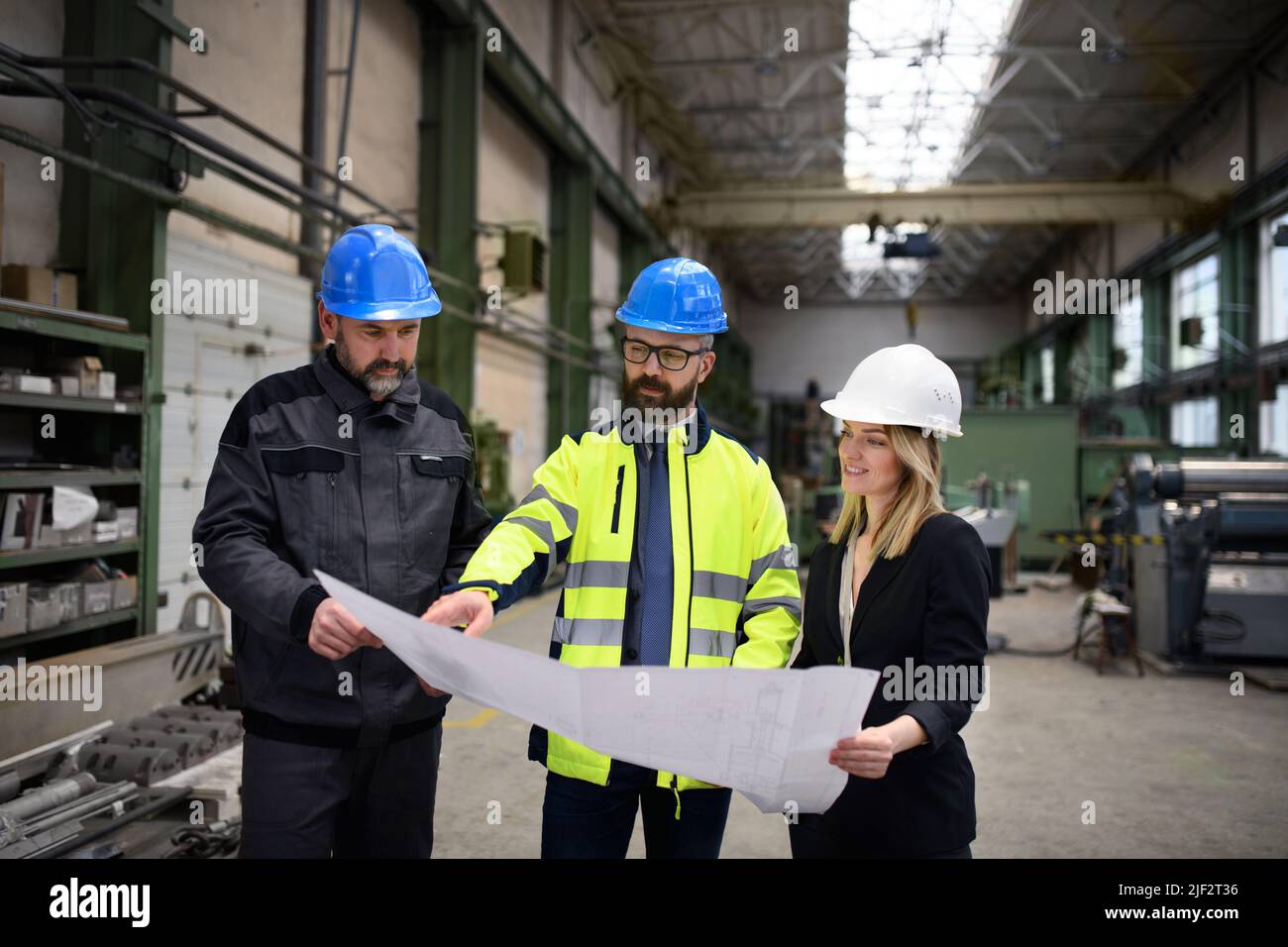 Manager supervisor, engineer and industrial worker in uniform ...