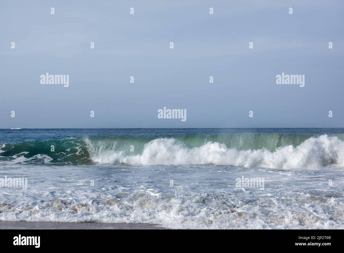 The big breaking waves during a strom at the beautiful summer sea shore ...