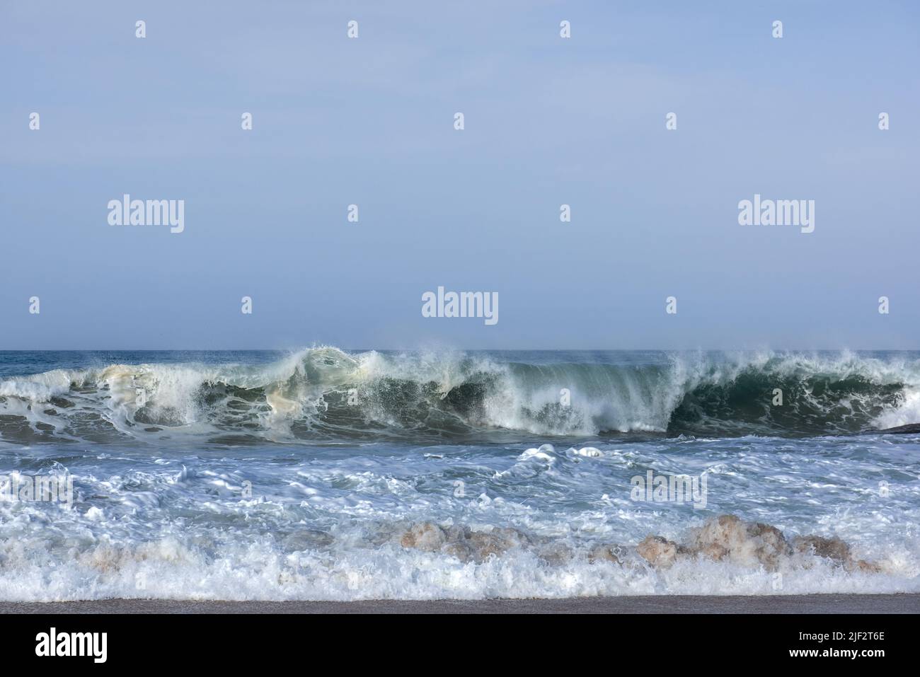 The big breaking waves during a strom at the beautiful summer sea shore ...