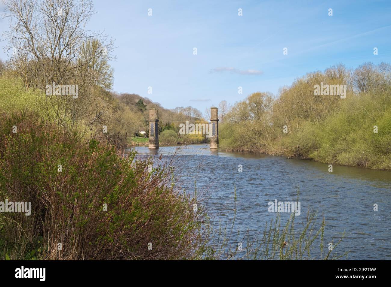 The brick abutments and piers are all that remain of Dowles Bridge which carries trains across ...