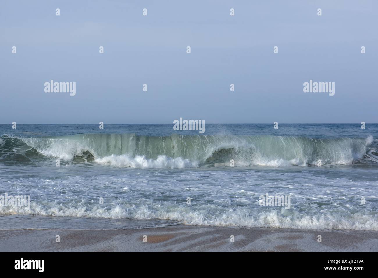 The big breaking waves during a strom at the beautiful summer sea shore ...