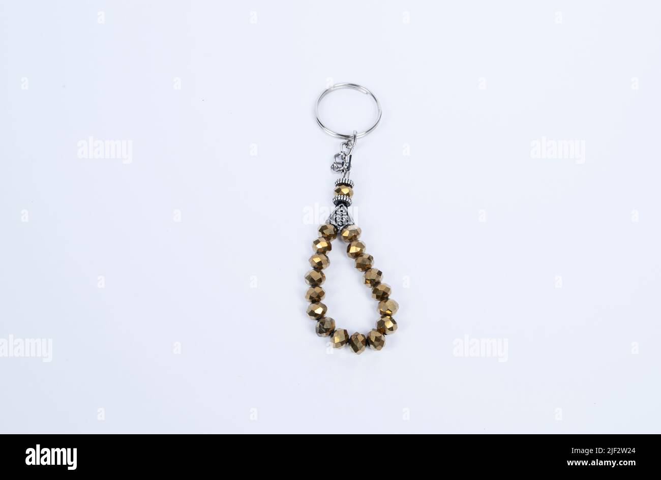 prayer beads with 33 knots made of stone on a matte surface on a white ...