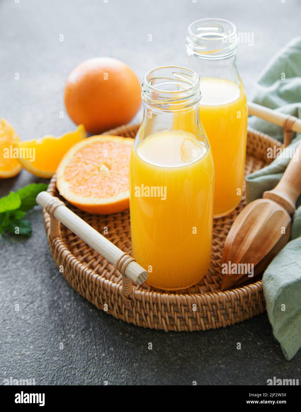 Bottles of fresh orange juice with fresh fruits Stock Photo - Alamy