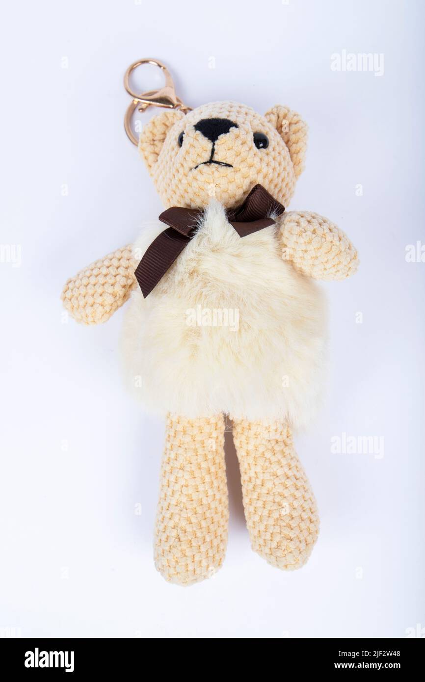 Brown rabbit doll sitting on white background Stock Photo - Alamy