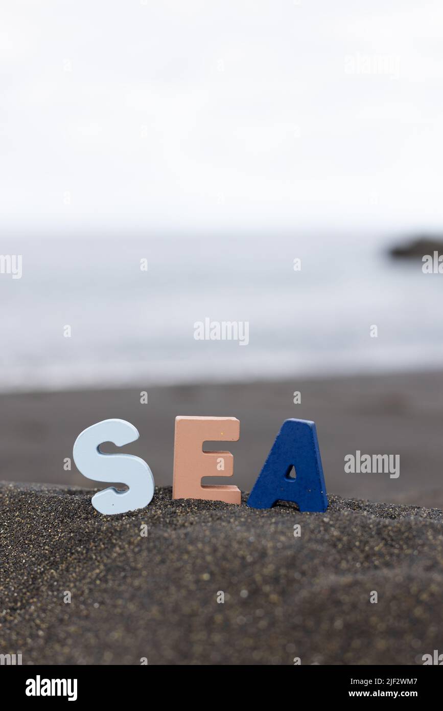 The word sea made of colourful wooden letters stands on the beach in ...