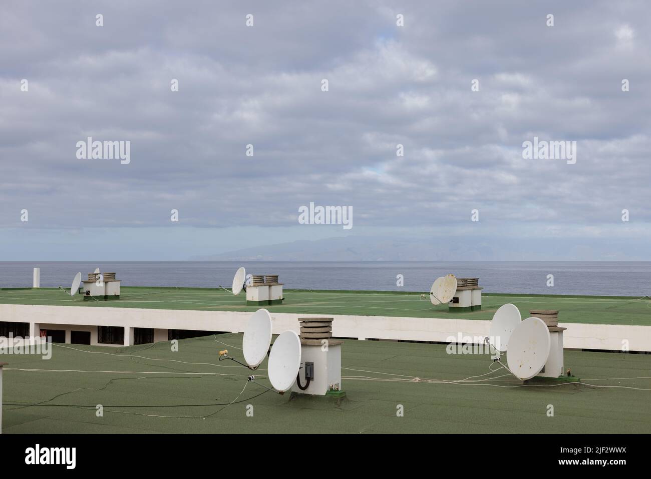 Satellite equipment on the rooftop of the residential building with ...