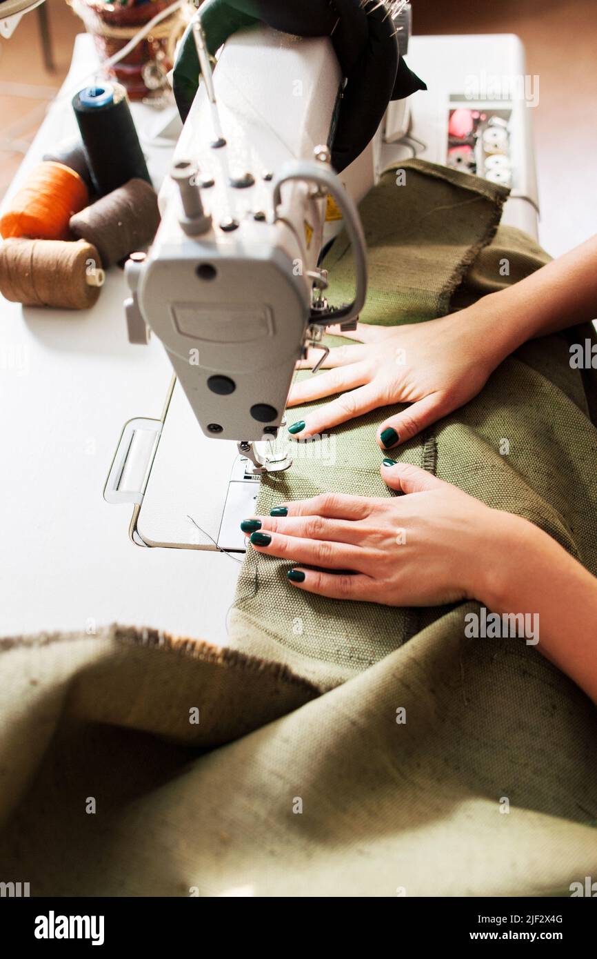 Seamstress sews clothes hand hi-res stock photography and images - Alamy