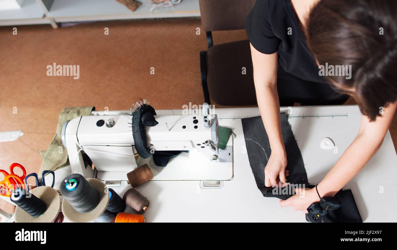 designer sews clothes Stock Photo - Alamy