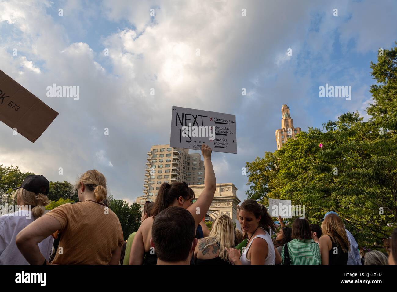 A crowd of protesters holding demonstration signs after Supreme Court ...