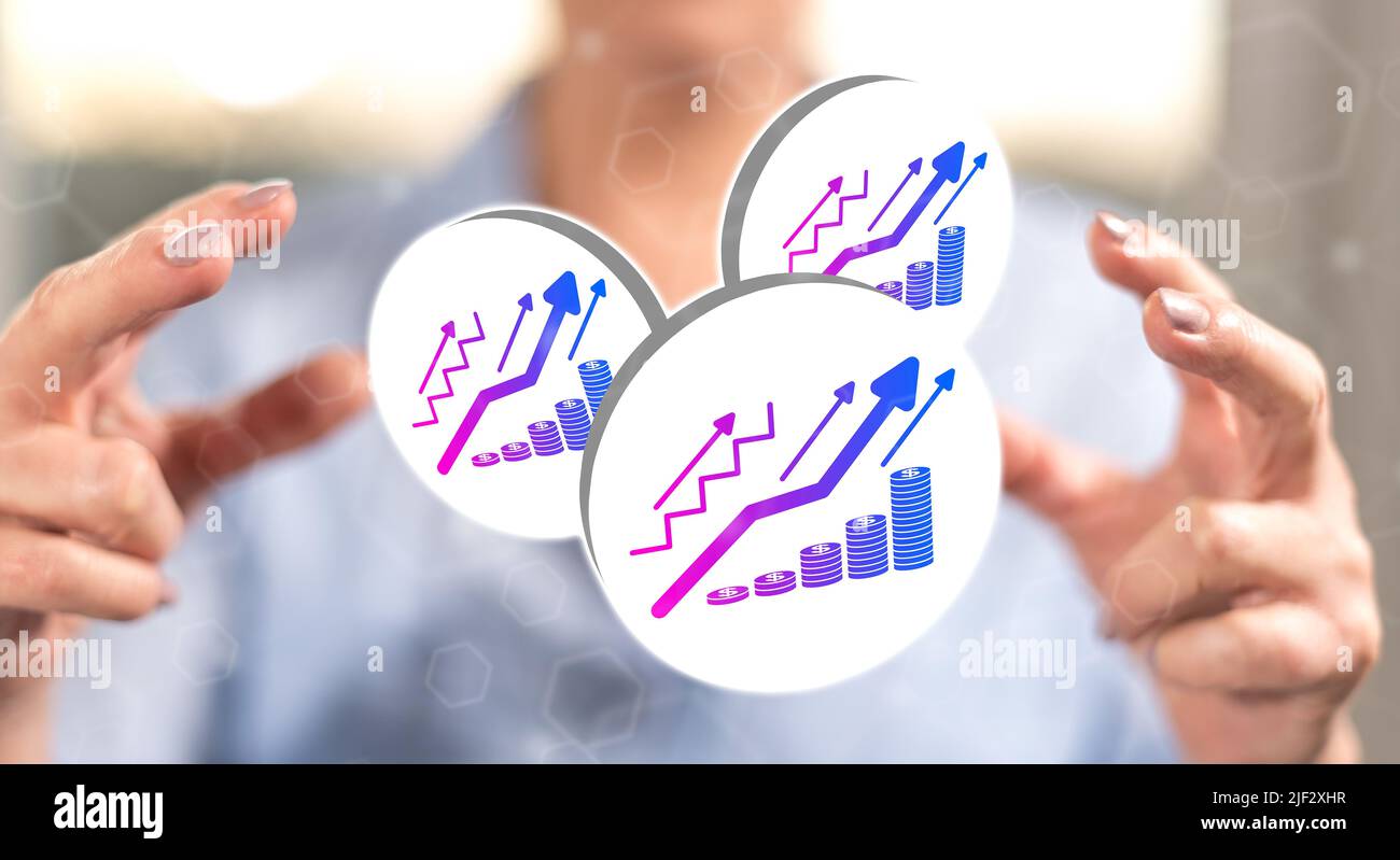 Growth concept between hands of a woman in background Stock Photo - Alamy