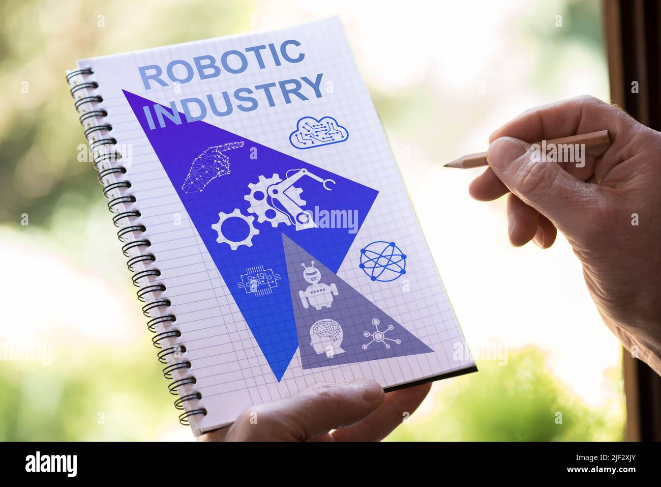Hand drawing robotic industry concept on a notepad Stock Photo - Alamy
